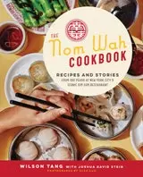 NomWah cookbook cover na may larawang dumplings na pinupulot gamit ang chopsticks.