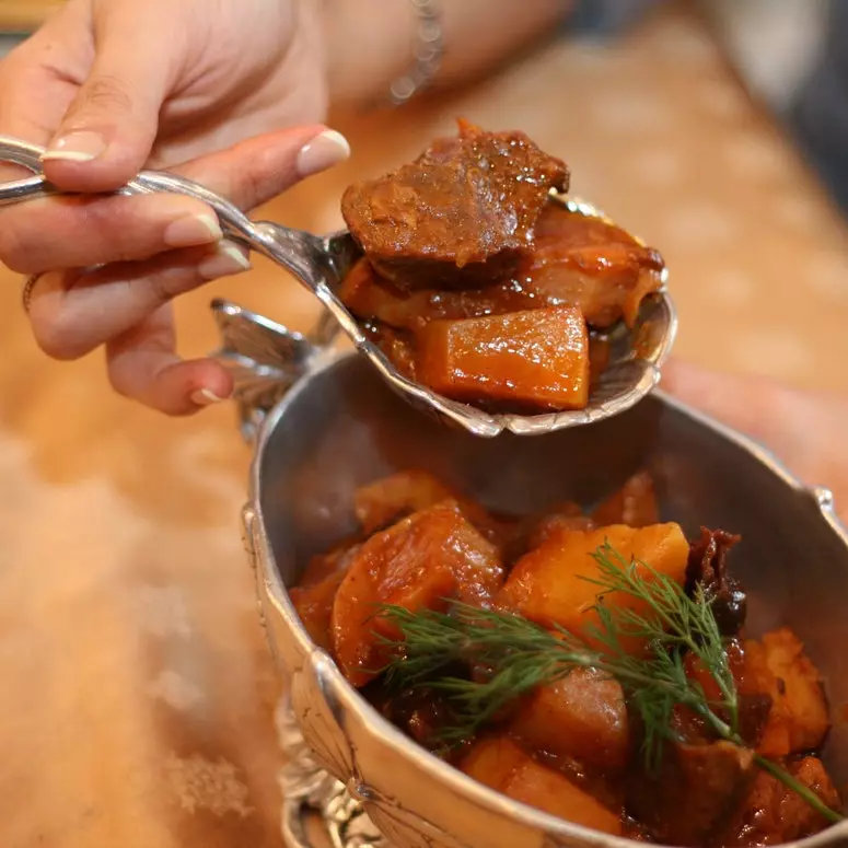 Image may contain Dish Food Meal Bowl Stew Human Person Curry and Plant