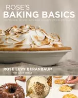 Насловна од готвачот на Rose's Baking Basics од Роуз Леви Беранбаум со фотографии од пита со меренга, колачиња од бадем, газирана торта со карамела и тесто што се меша со гумена шпатула.